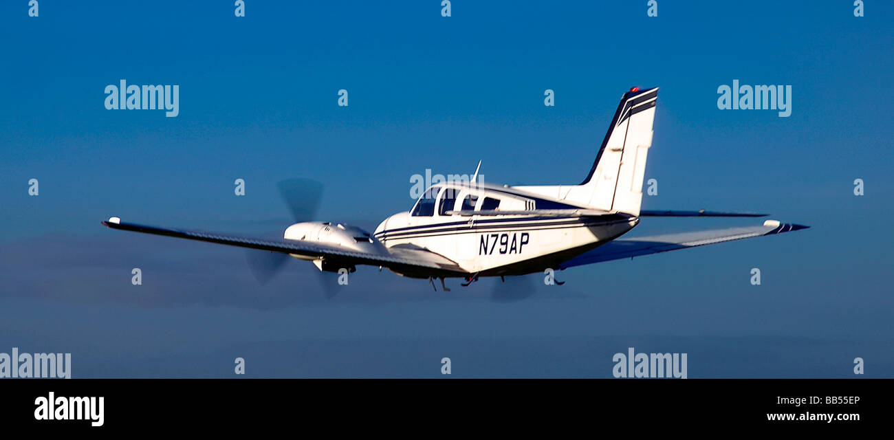 Small plane flying Stock Photo - Alamy