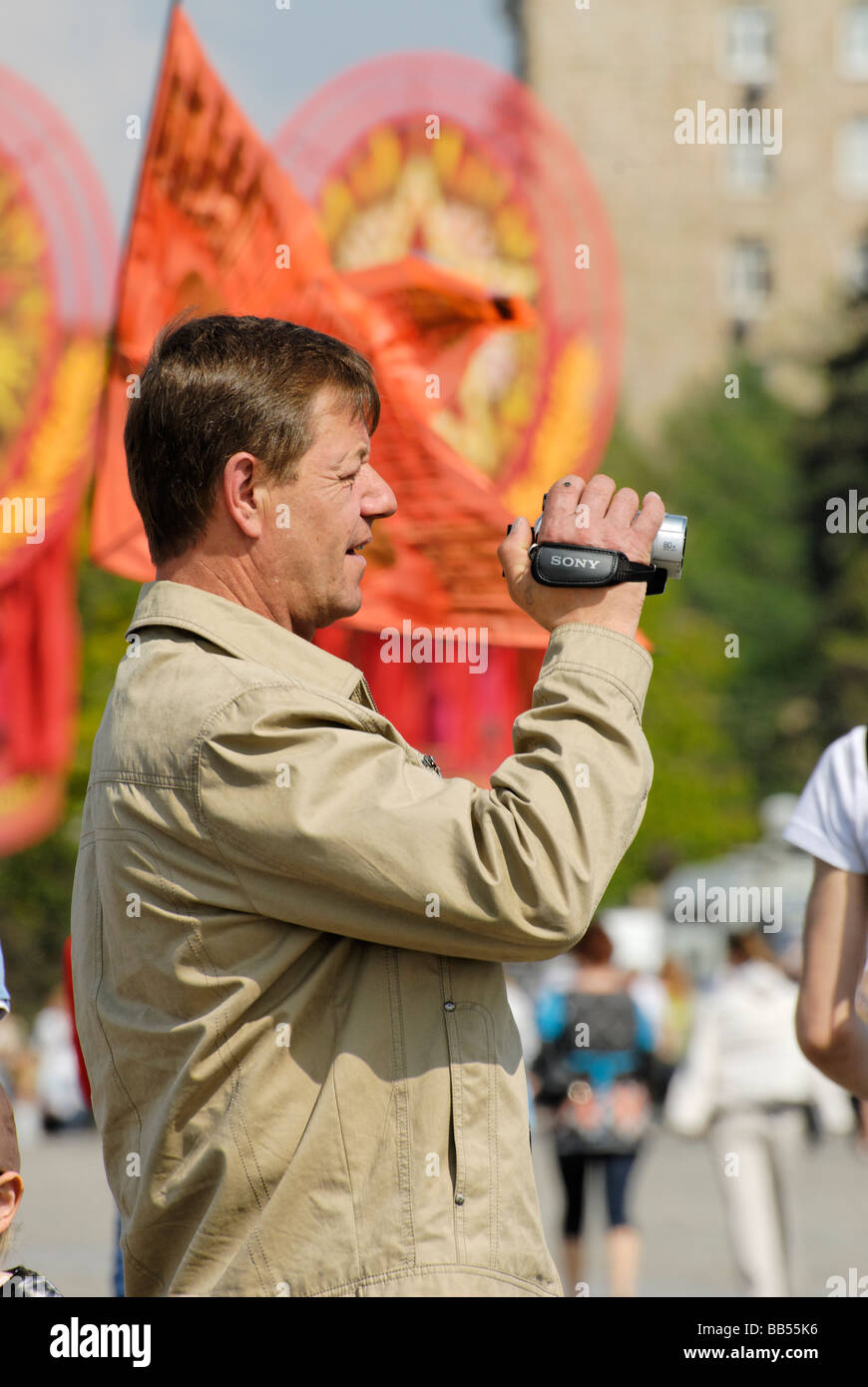 A man with compact video camera Stock Photo - Alamy