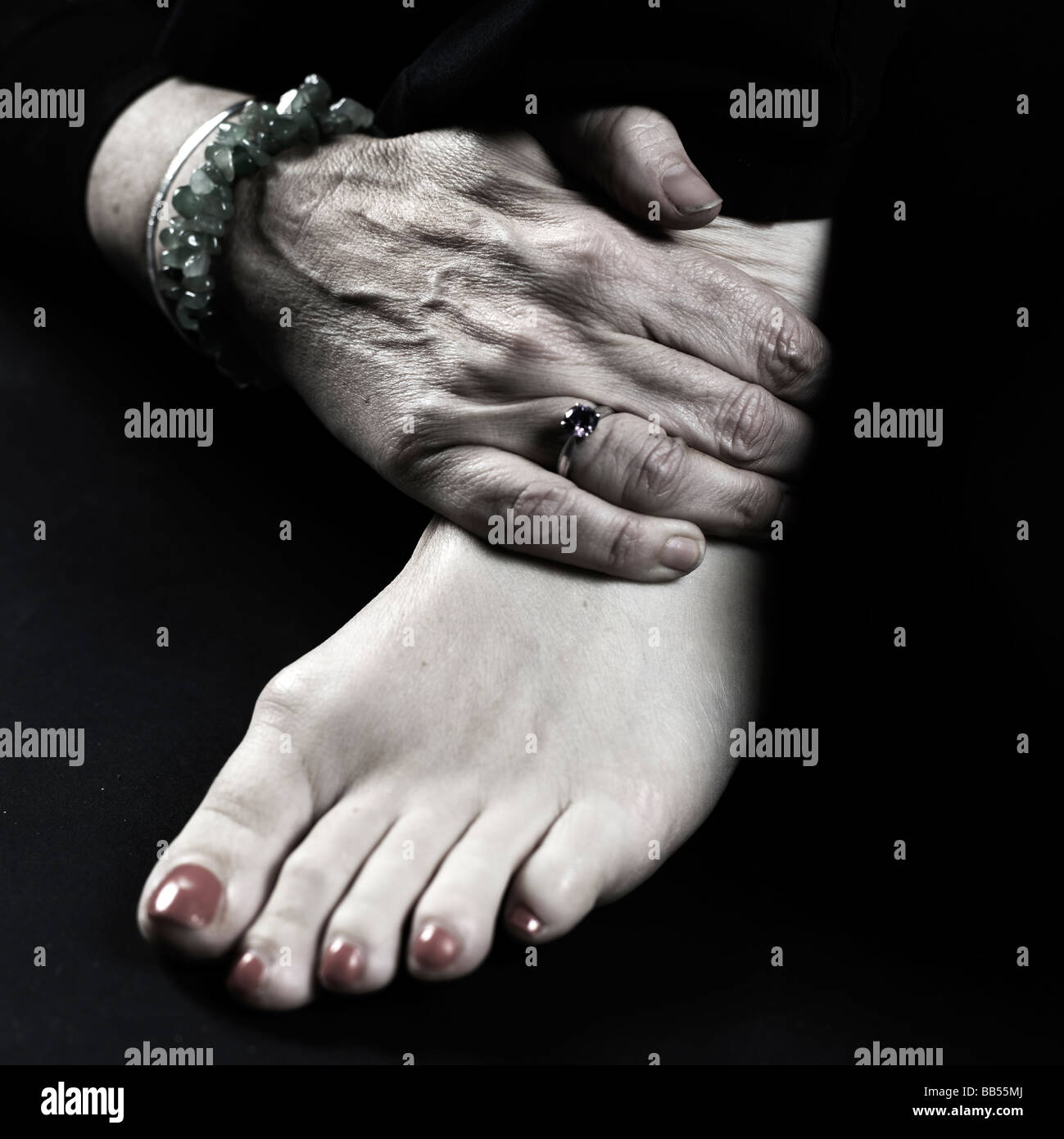 yoga Ardha Matsyendrasana seated twist pose detail ankle hand Stock ...