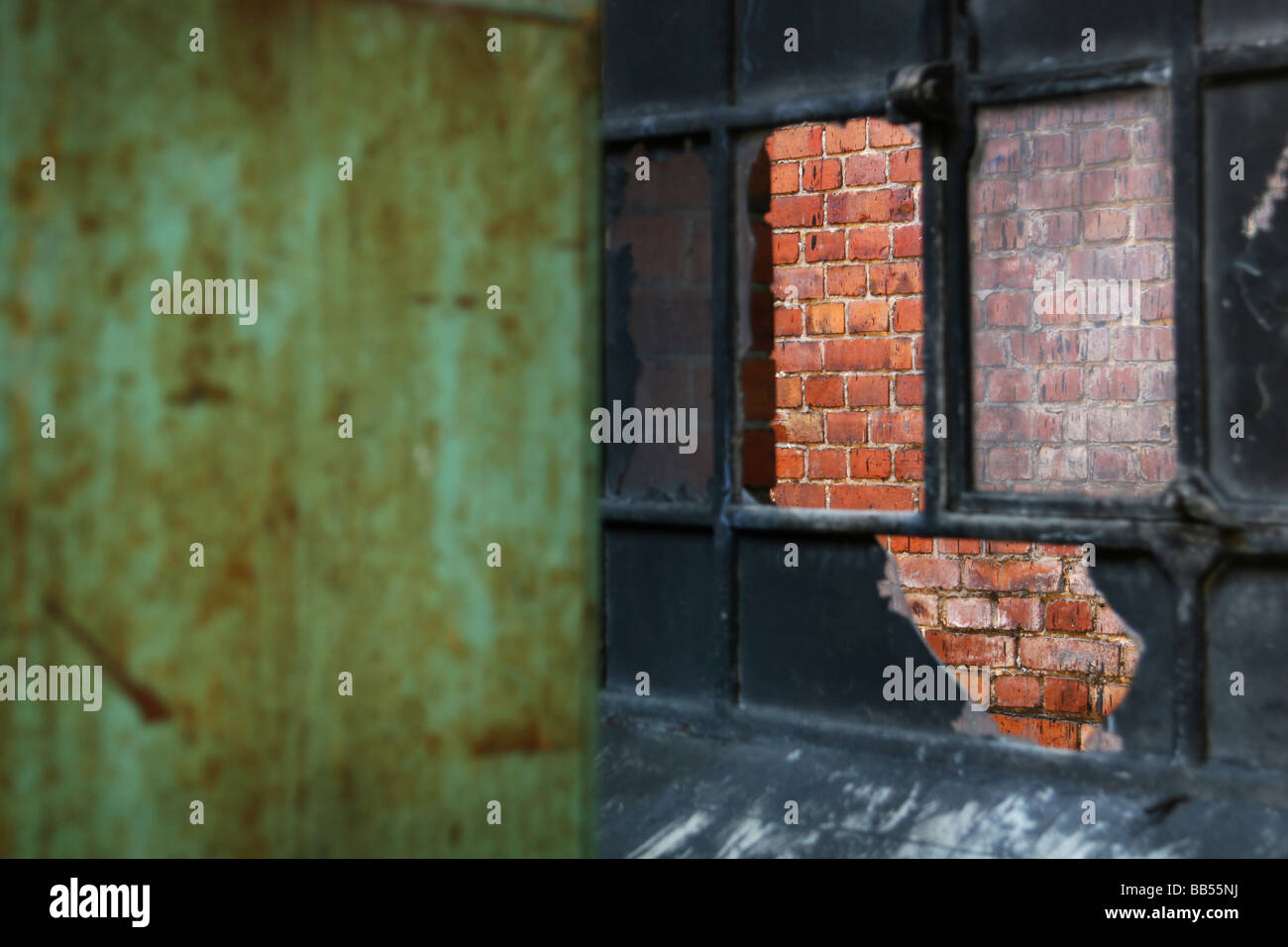 Red brick wall with broken glass Stock Photo - Alamy