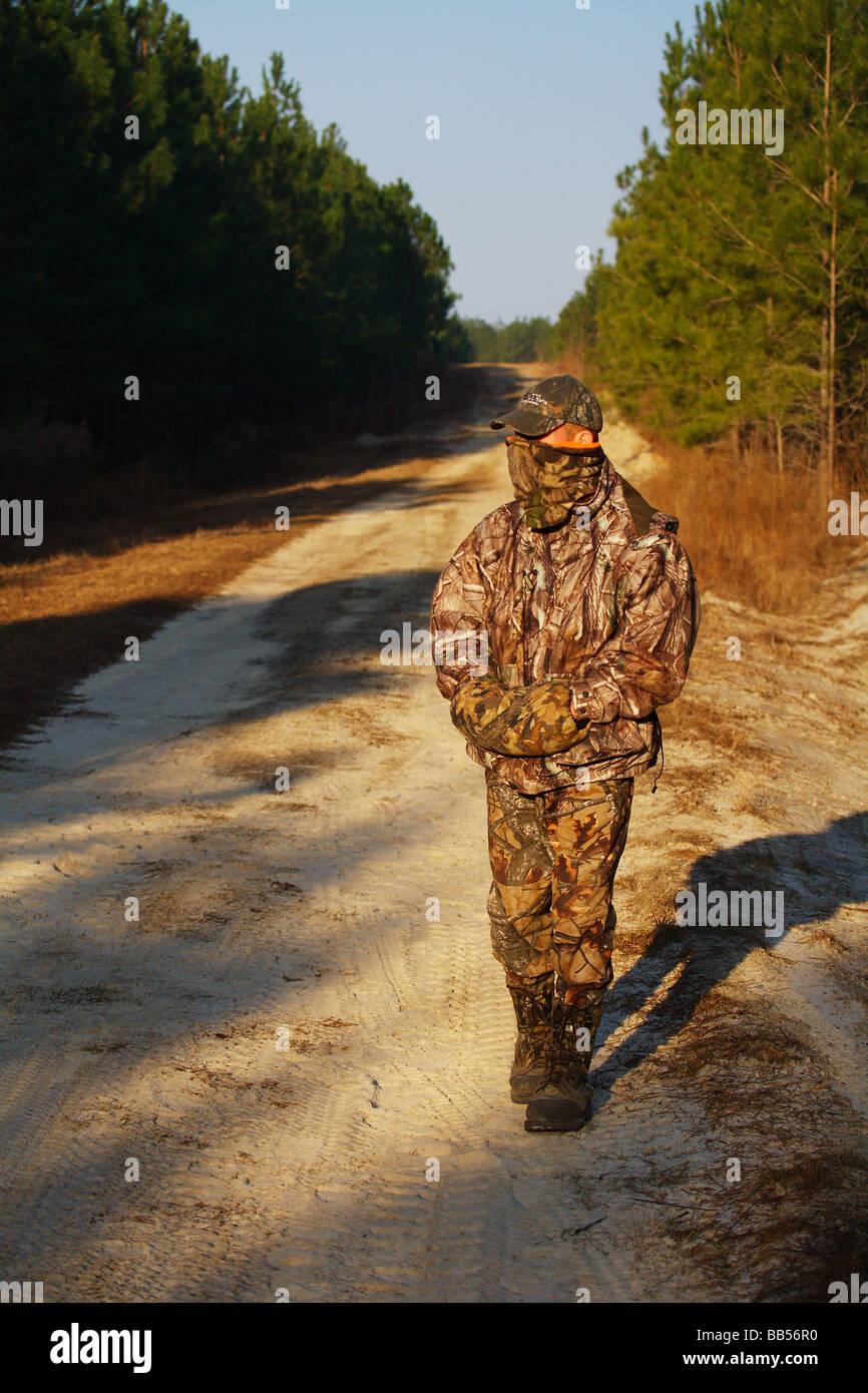 HUNTER WALKING ACCESS ROAD LOOKING LISTENING WATCHING FOR WILD BOAR ...