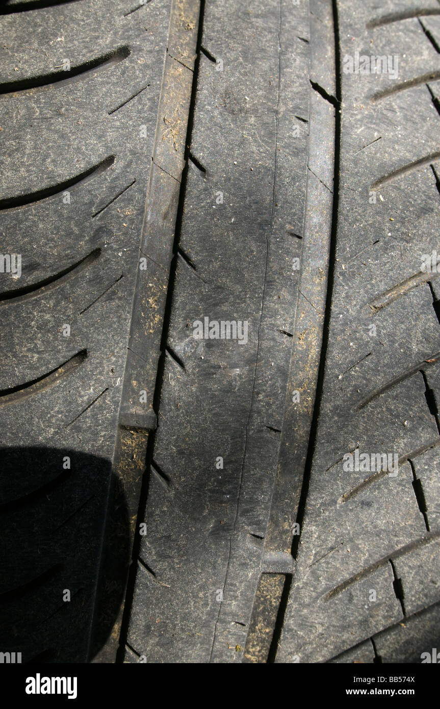 Worn tyres thread bare Stock Photo - Alamy