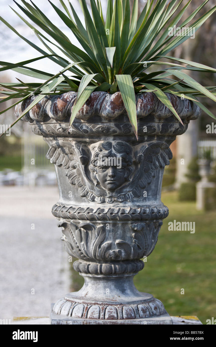 Sculpted stone vases decorate the gardens in the back of the Governor's ...