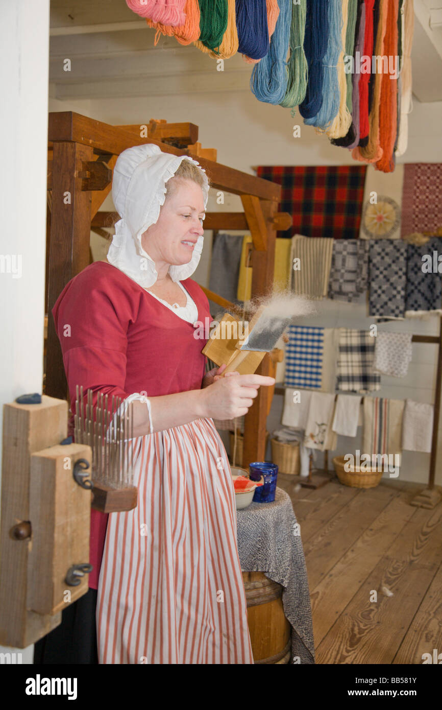 A period actor plays the role of a weaver in Colonial Williamsburg ...