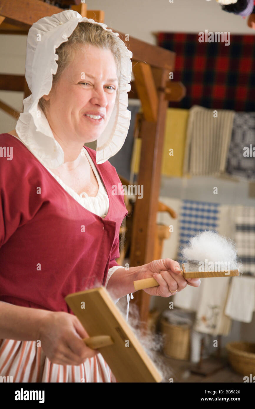 A period actor plays the role of a weaver in Colonial Williamsburg ...