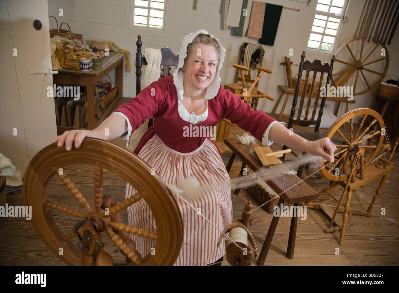 A period actor plays the role of a weaver in Colonial Williamsburg ...