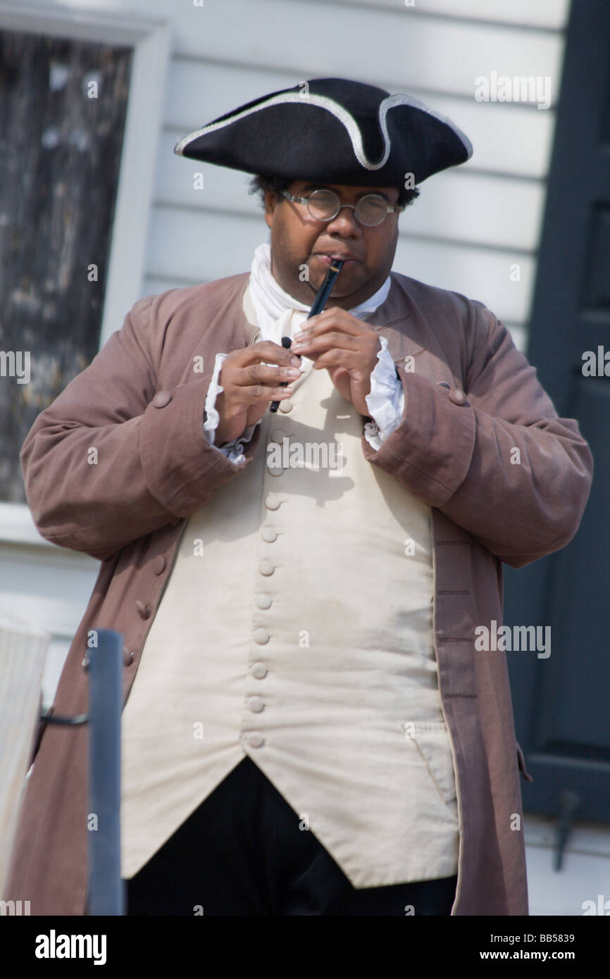 A period actor in Colonial Williamsburg, Virginia plays a flute Stock ...
