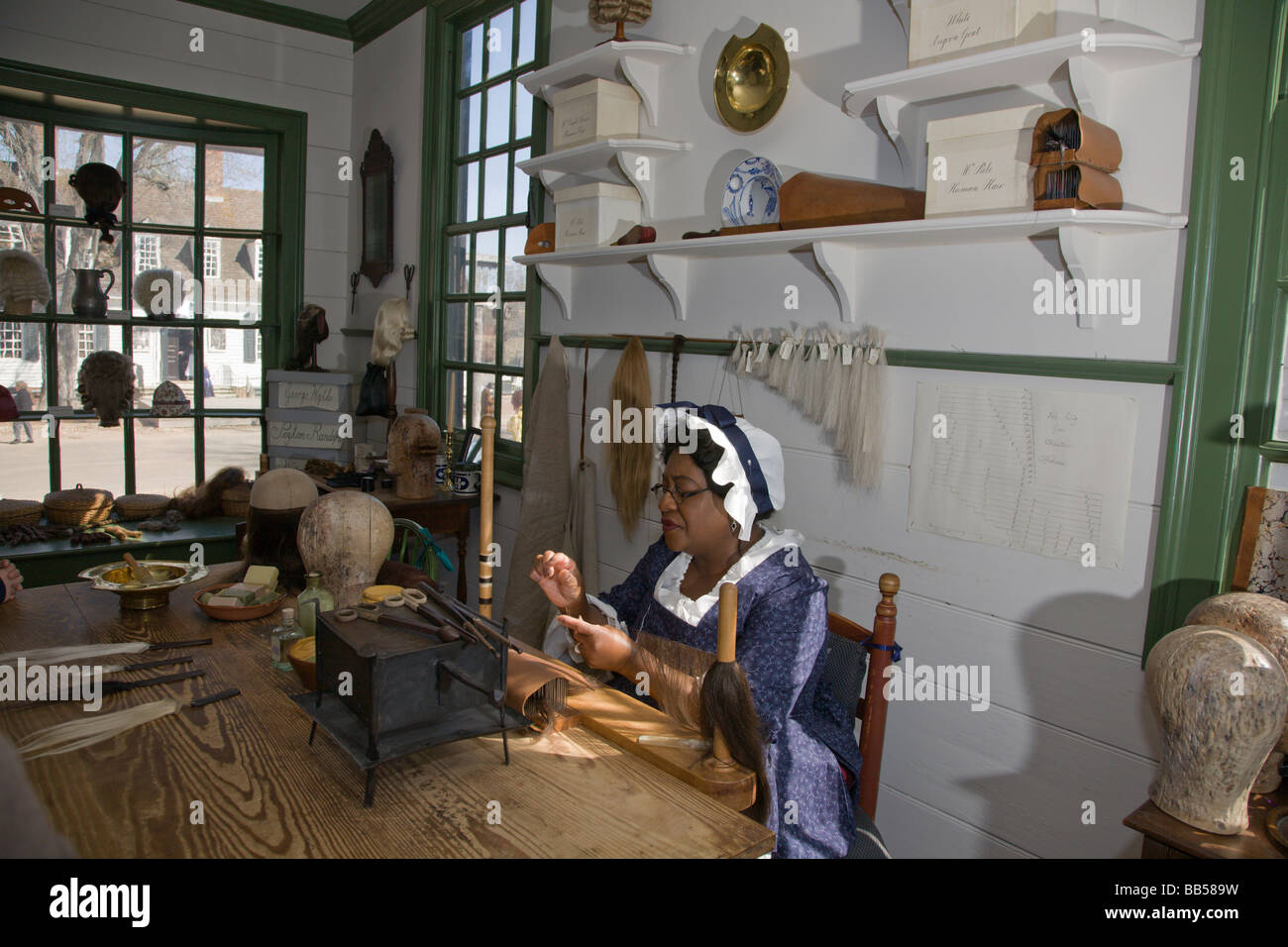 A woman makes a wig in the Barber & Peruke Maker Shop at Colonial ...