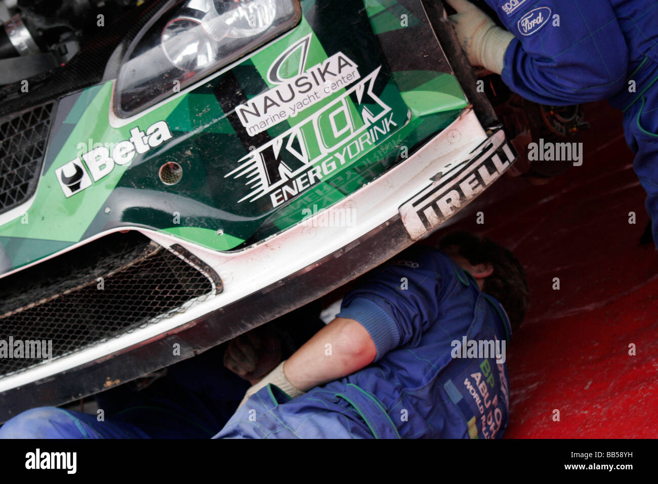 Mechanics fixing a Ford Focus at the Sardinian World Rally Championship ...