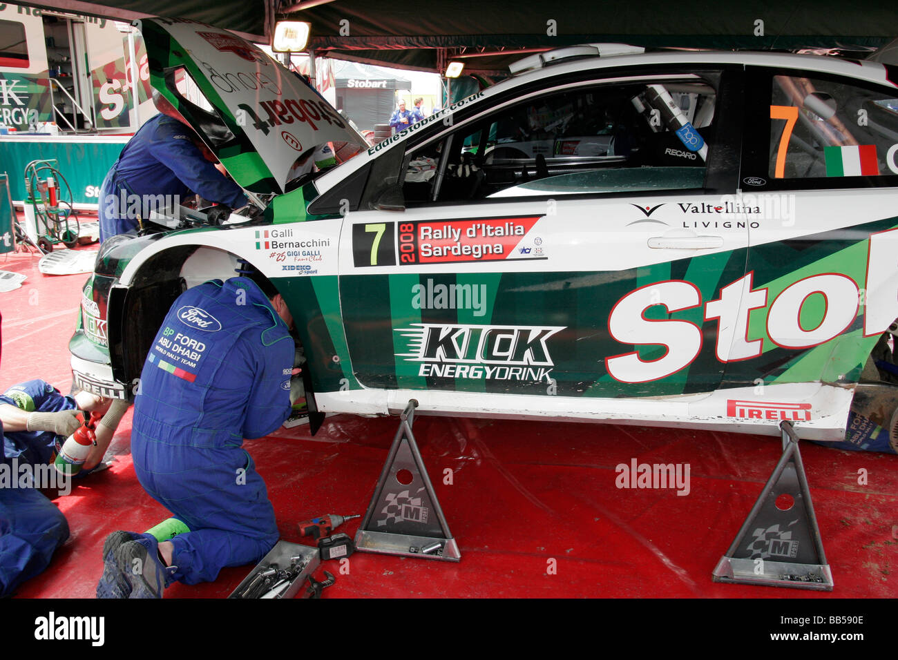 Mechanics around a Ford Focus at the Sardinian World Rally Championship ...