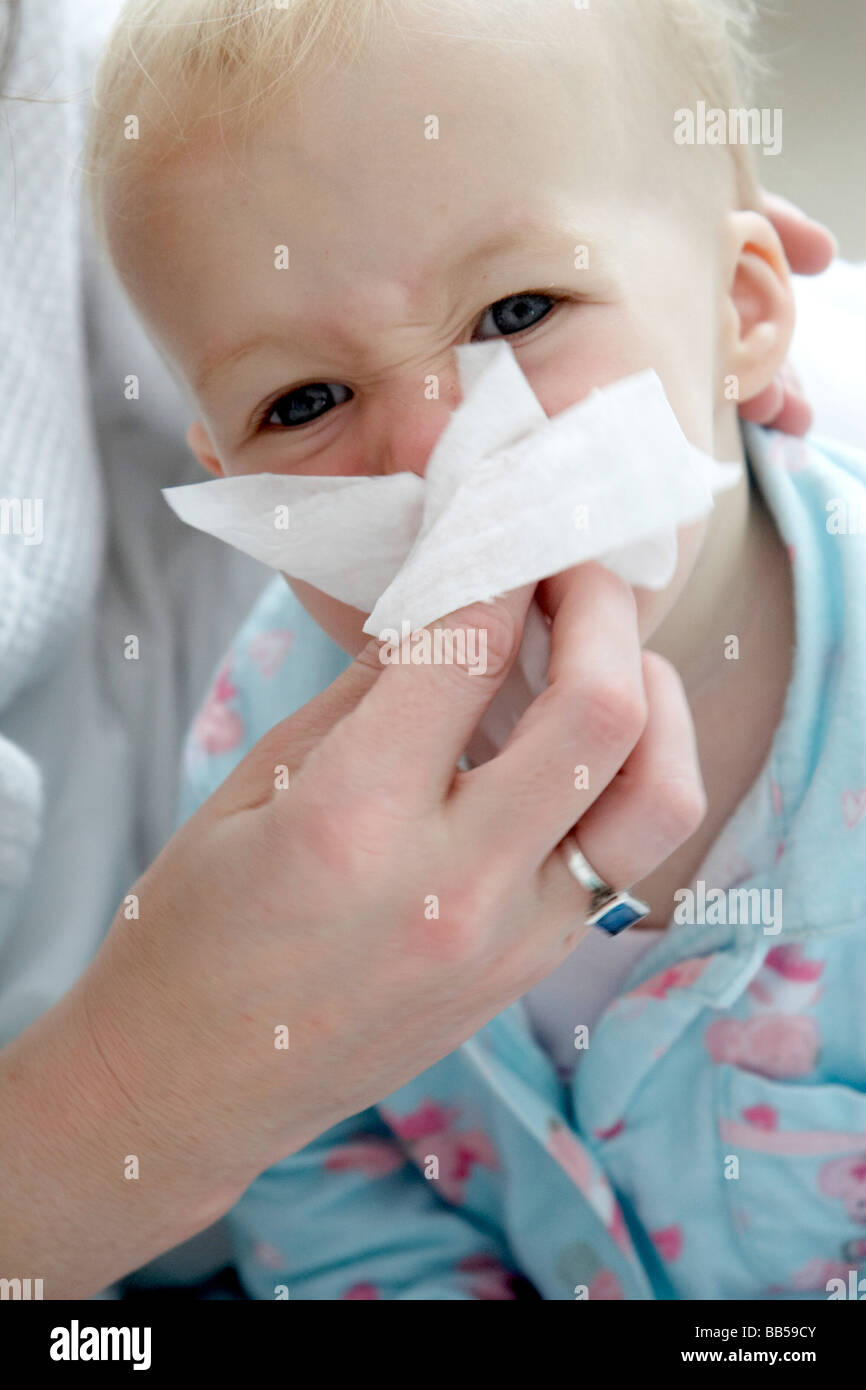 BABY HAVING NOSE BLOWN Stock Photo - Alamy