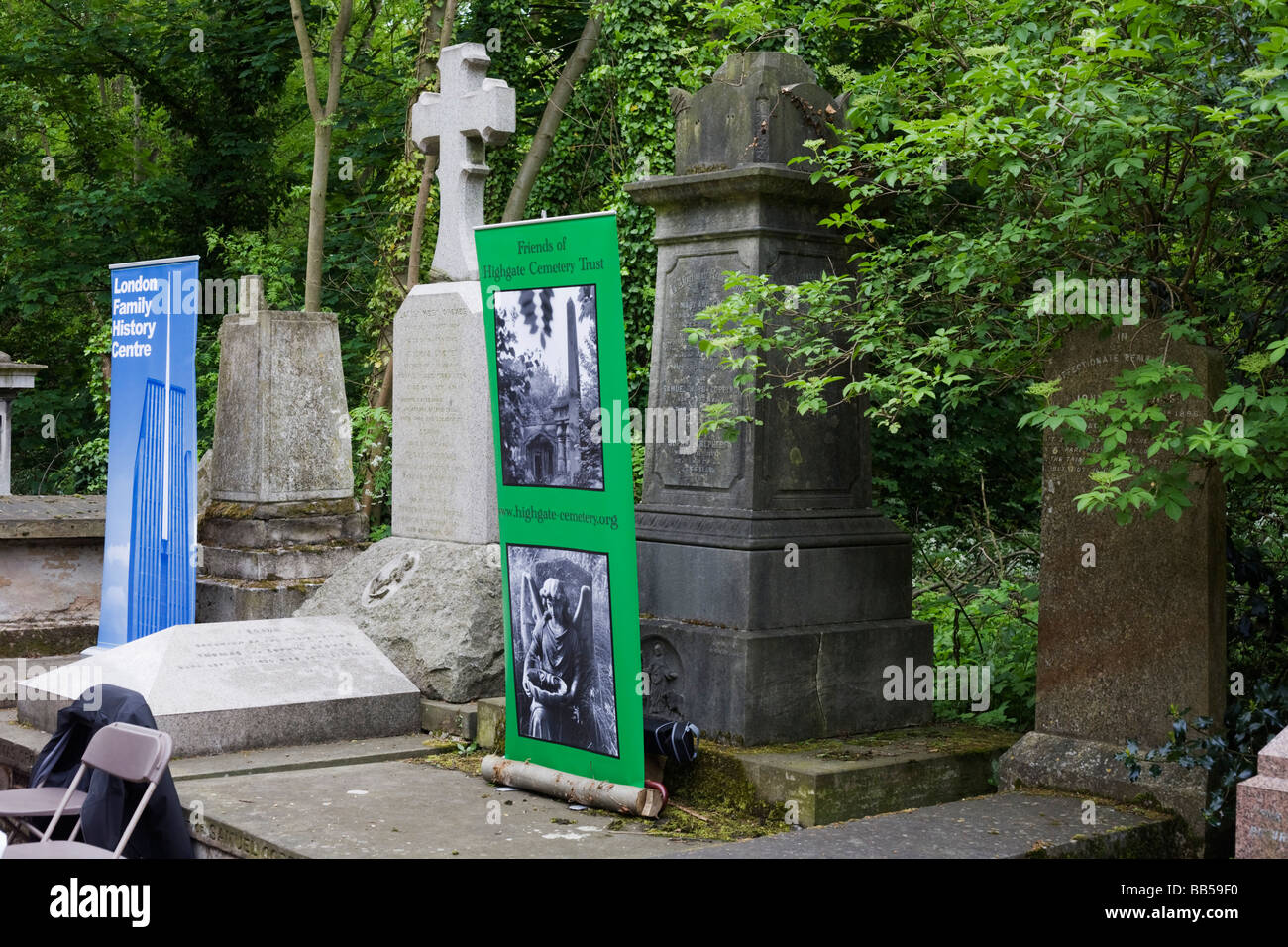A genealogy society has a stall next to tombs and memorials during ...