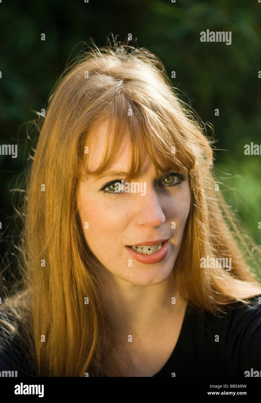 Portrait of Red haired Woman talking Stock Photo - Alamy