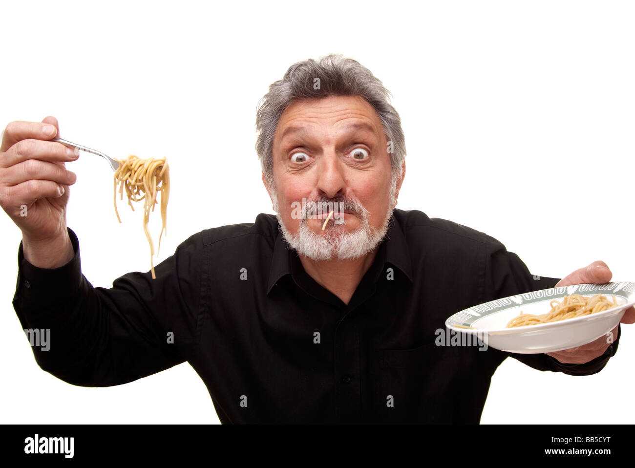 man eating a bowl of pasta Stock Photo - Alamy