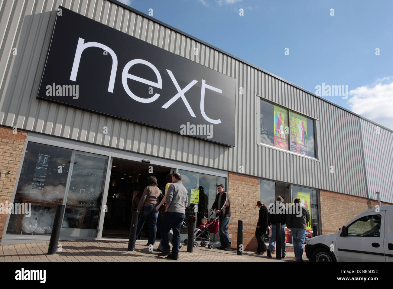 People going into Next store Stock Photo - Alamy