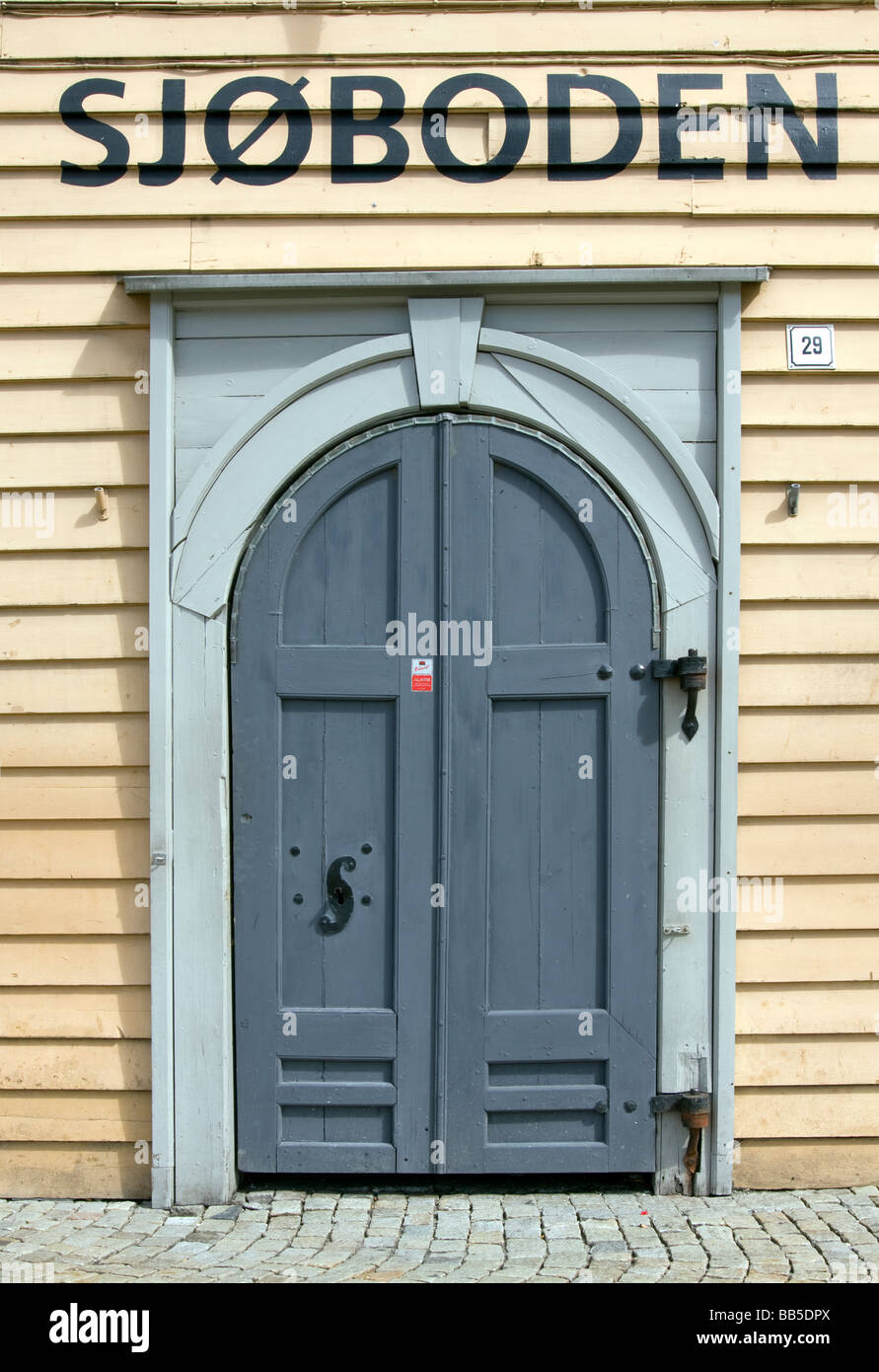 Doorway in one of the old hanseatic houses on the quay / wharf at the ...