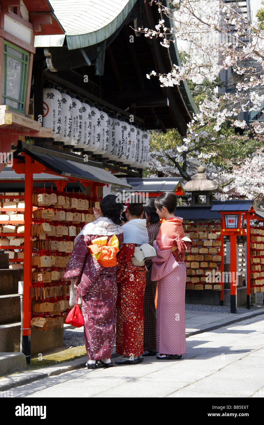 Women dressed as Geisha wearing Kimono at a temple in Kyoto, Japan ...
