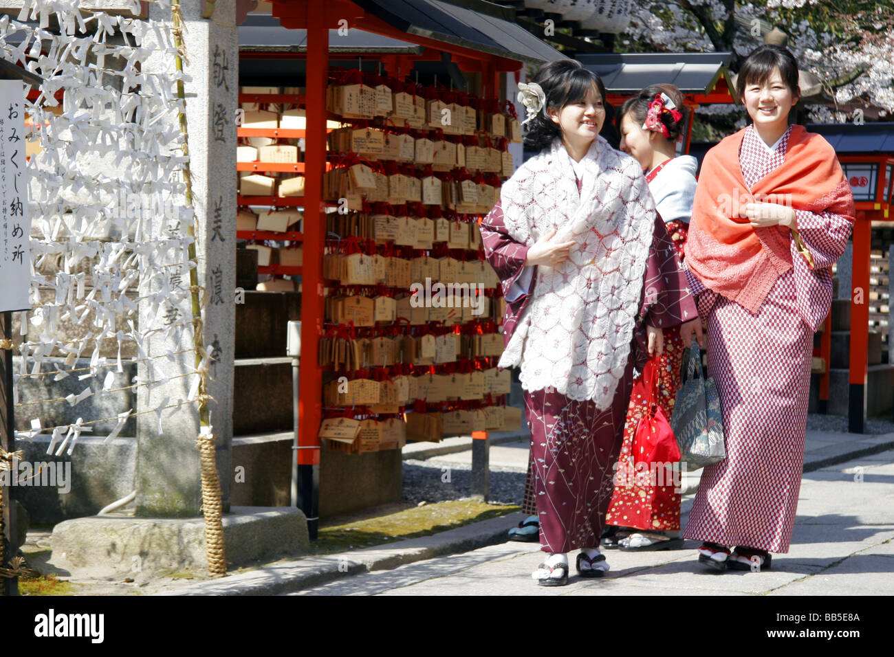Women dressed as Geisha wearing Kimono at a temple in Kyoto, Japan ...