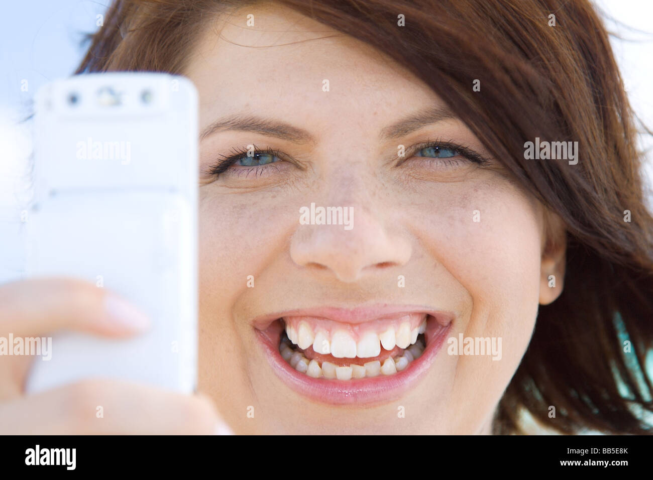 picture of happy woman using phone camera Stock Photo - Alamy