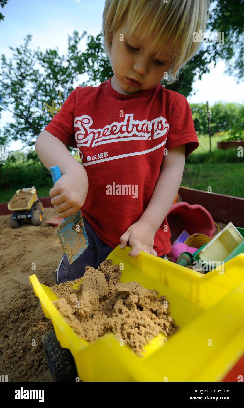 Baby boy boys in sand pit playing toys car cars vehicle playground 2 3 ...
