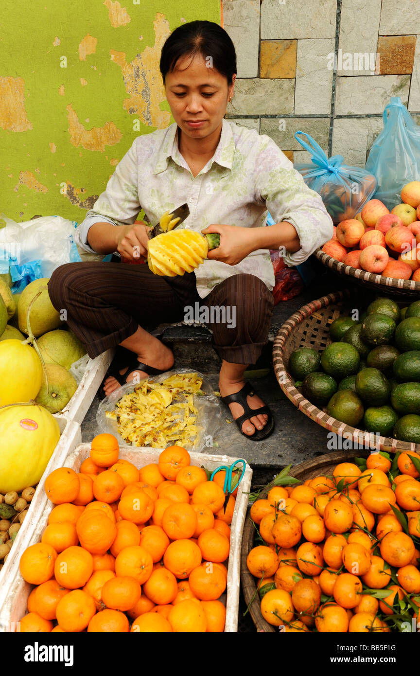 fruit vender cutting pineapple market in Old Quarter, Hanoi, vietnam ...