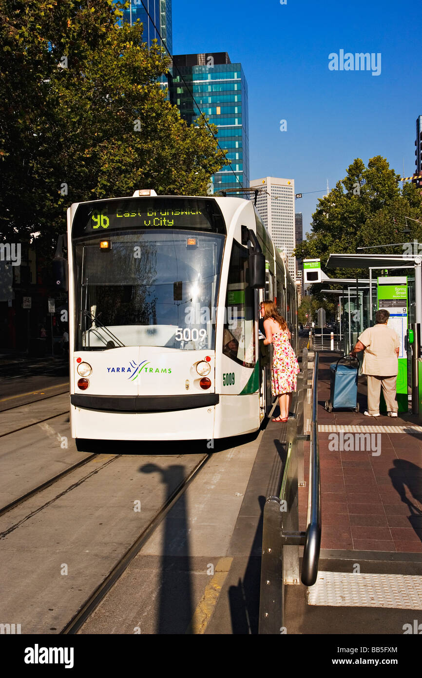 Melbourne Australia / A Melbourne tram is stationary at a tram stop in ...