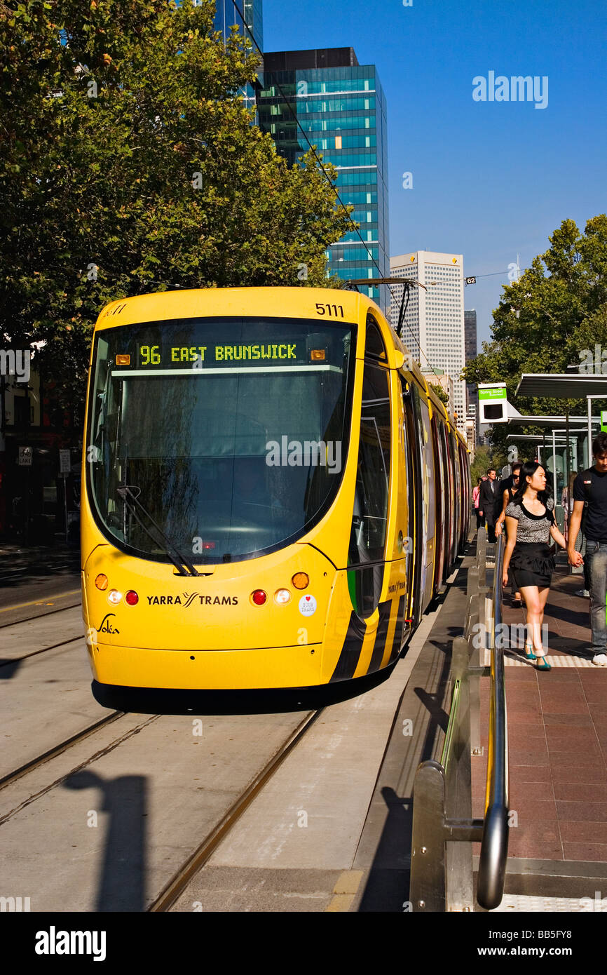 Melbourne Australia / A Melbourne tram is stationary at a tram stop in ...