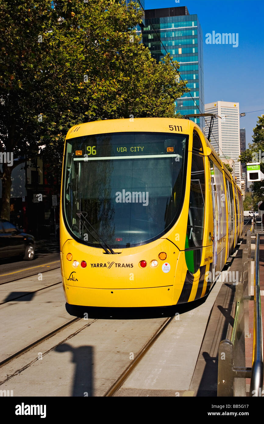 Melbourne Australia / A Melbourne tram is stationary at a tram stop in ...