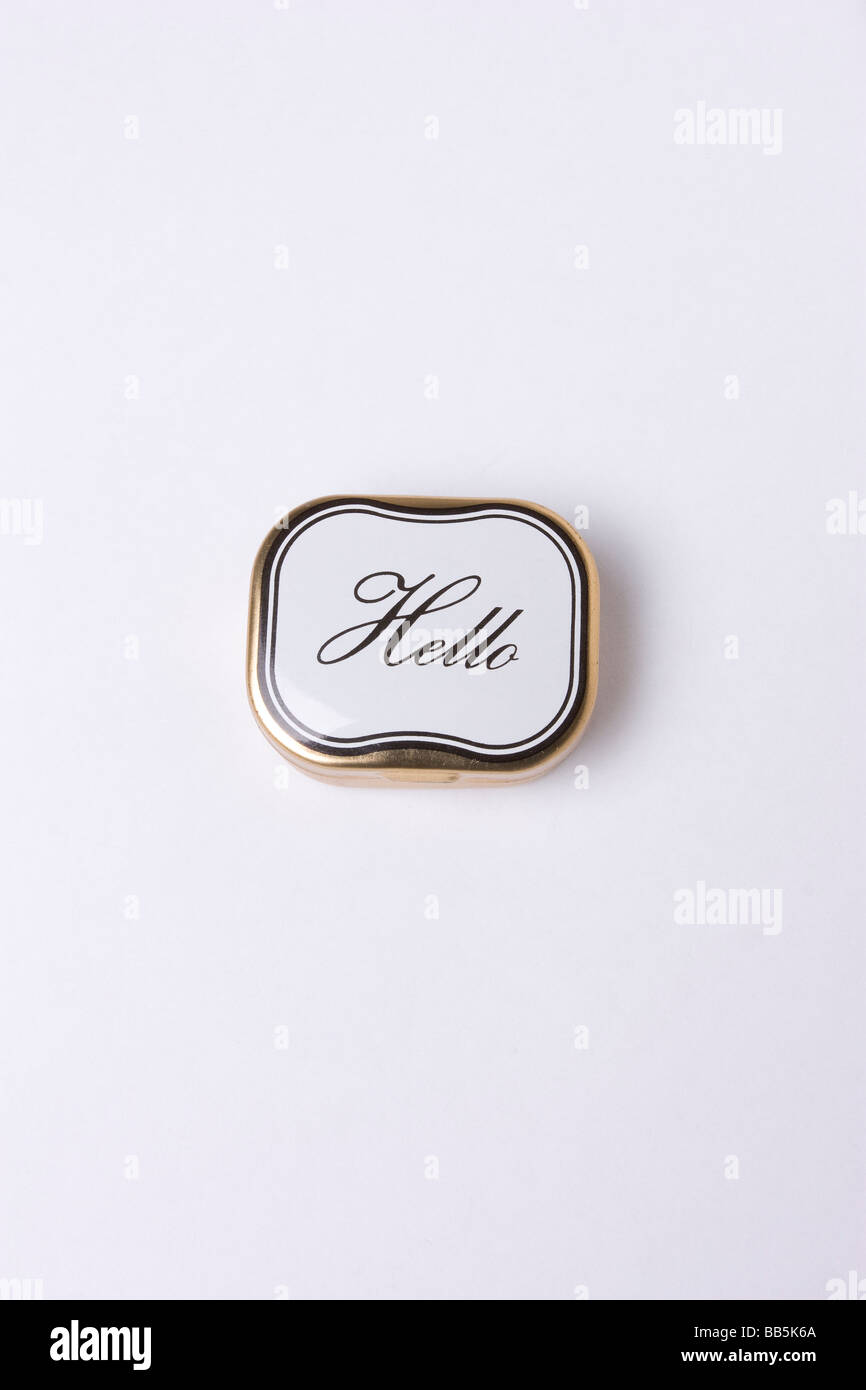 Small enamelled pill box with hello written on it Stock Photo - Alamy