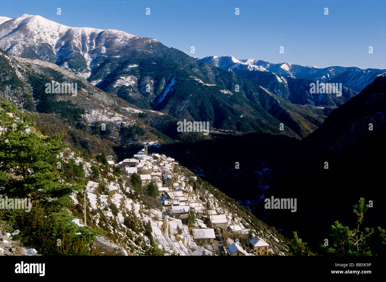 isolated and snowed roof top of the village of Venanson in the Vesubie ...