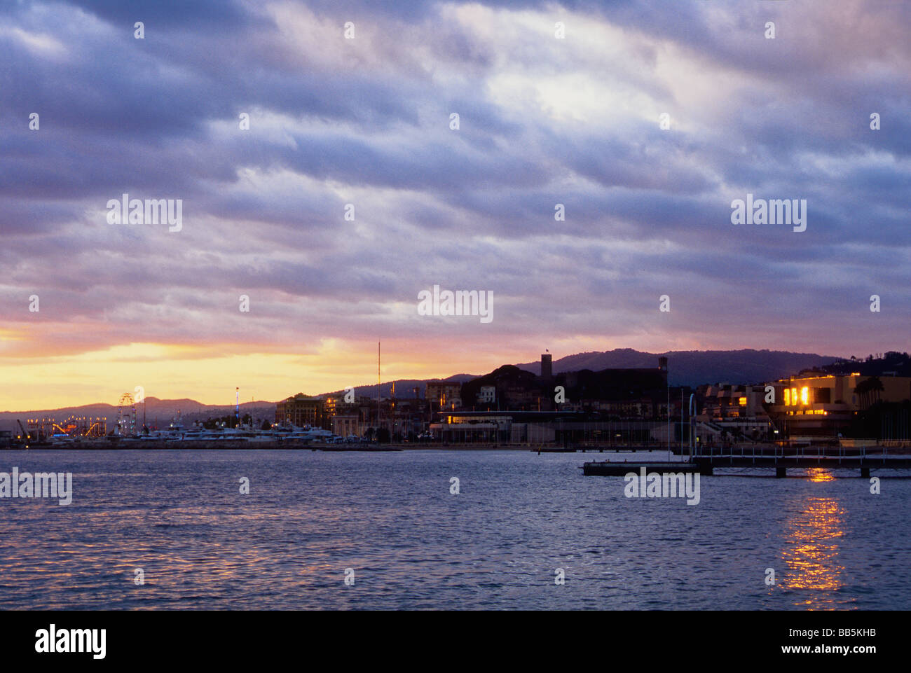 Sunset above the shore of Cannes city Stock Photo - Alamy