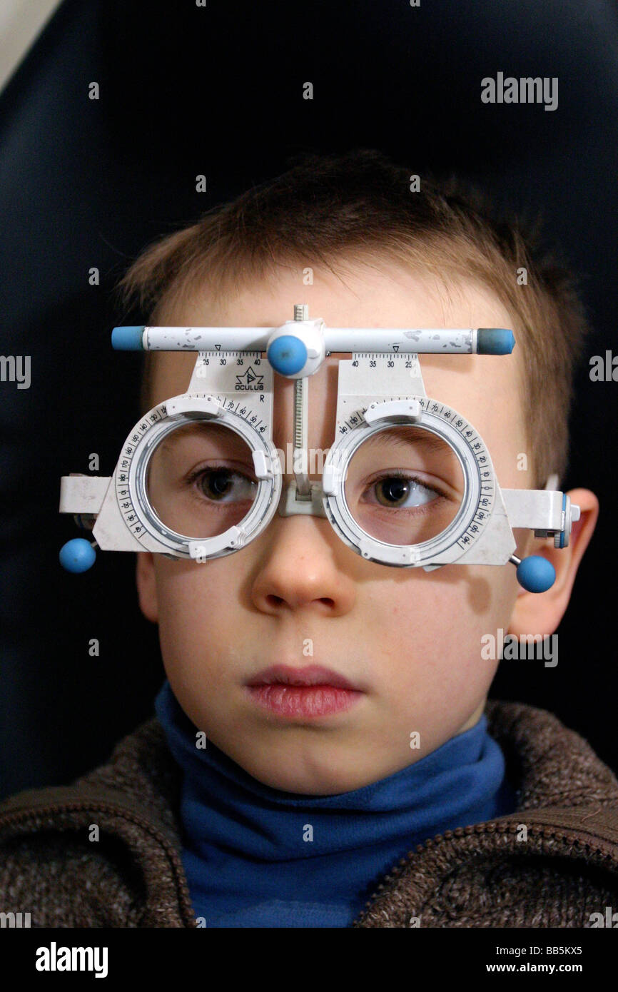young boy having eyes tested at opticians Stock Photo - Alamy