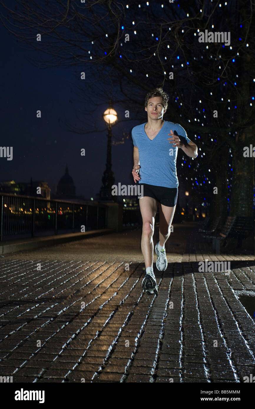 Man jogging at night Stock Photo - Alamy