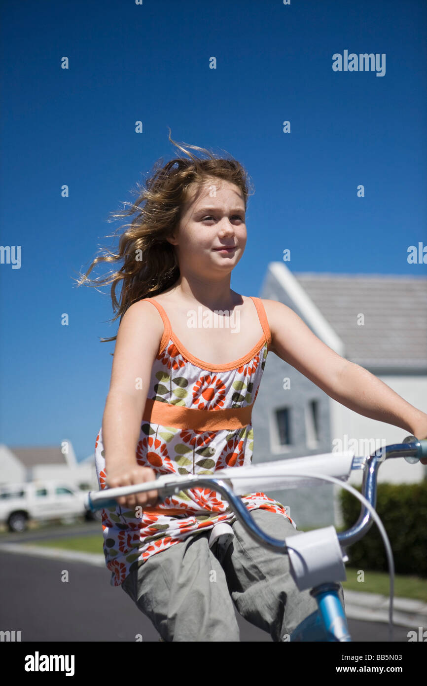 South Africa, Cape Town, girl riding bicycle Stock Photo - Alamy