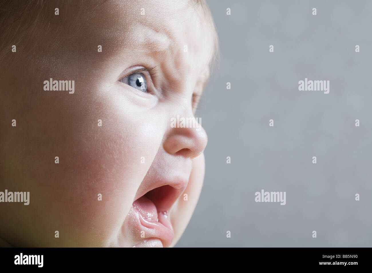 Baby girl crying, close-up Stock Photo - Alamy