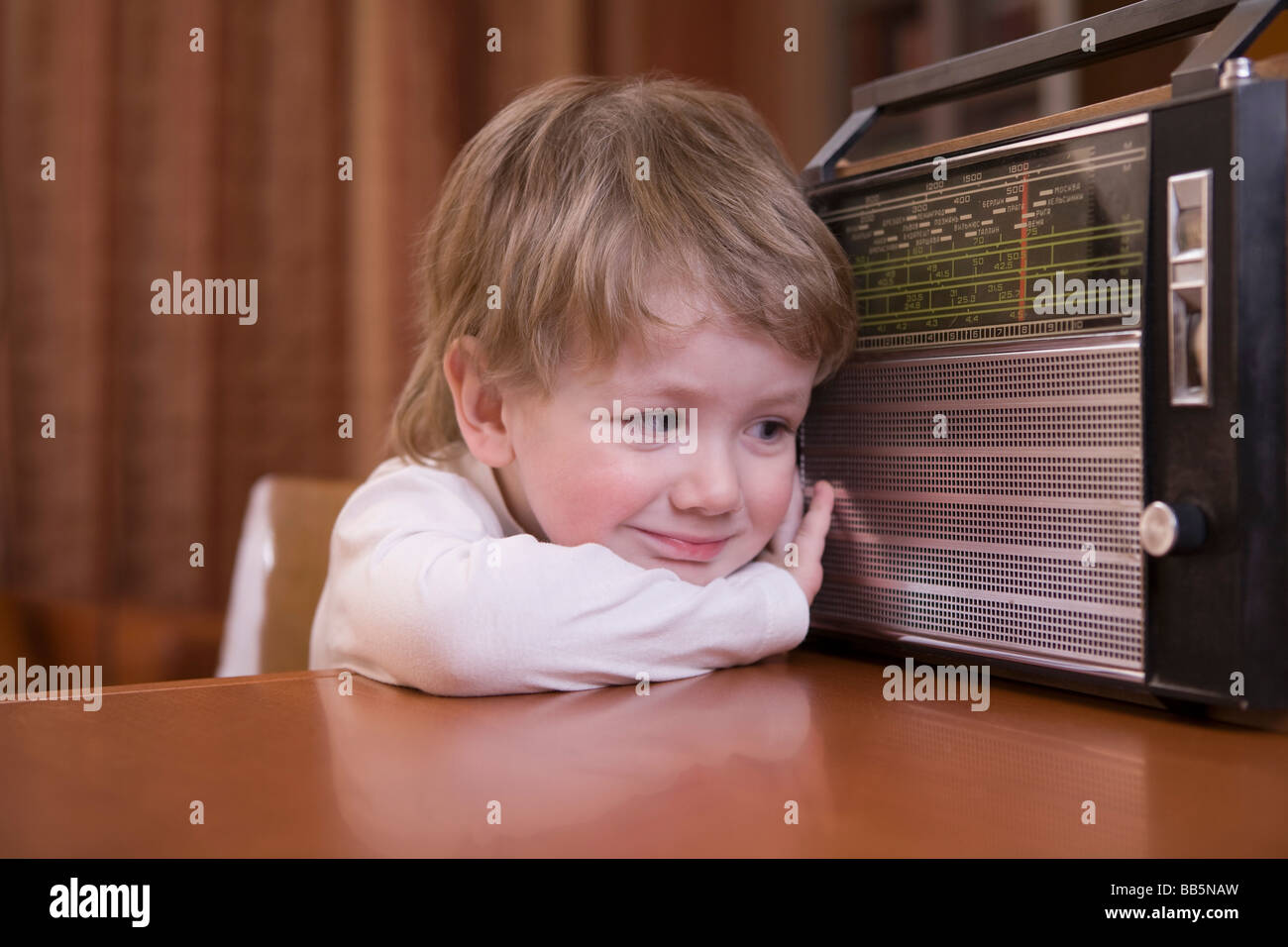 Boy listening to retro radio Stock Photo - Alamy