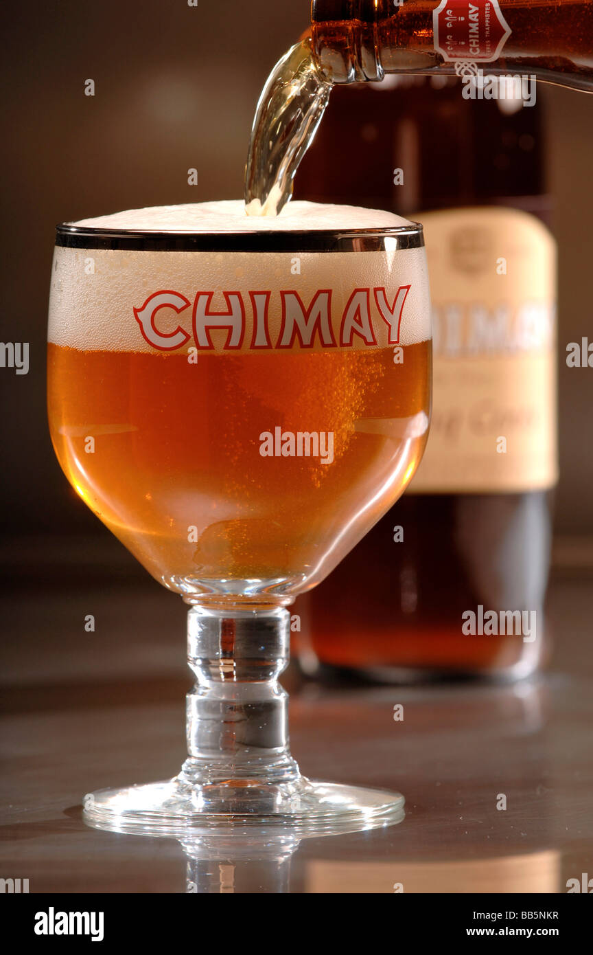 Pouring glass of Chimay Capsule Blanch Trappist Belgian beer Stock ...