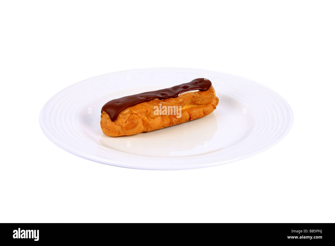 A single Chocolate Eclair on a plate against a white background Stock ...
