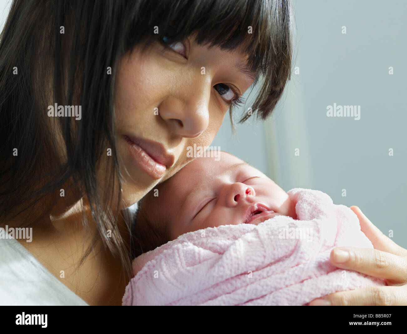 Girl years cuddling baby hi-res stock photography and images - Alamy