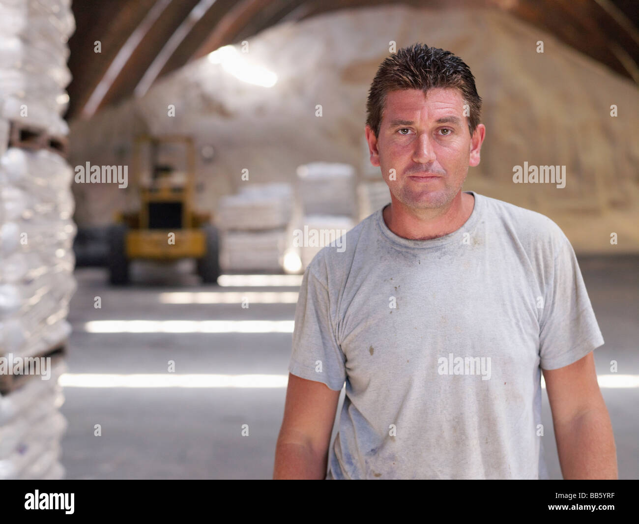 Hispanic worker in factory warehouse Stock Photo - Alamy