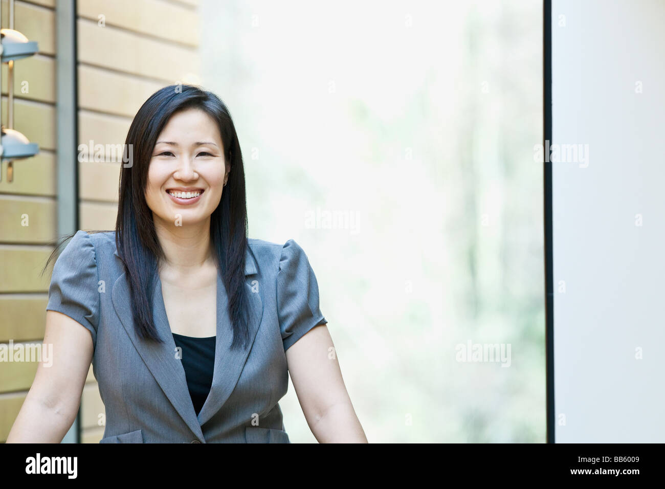 Office smiling asian woman hi-res stock photography and images - Alamy
