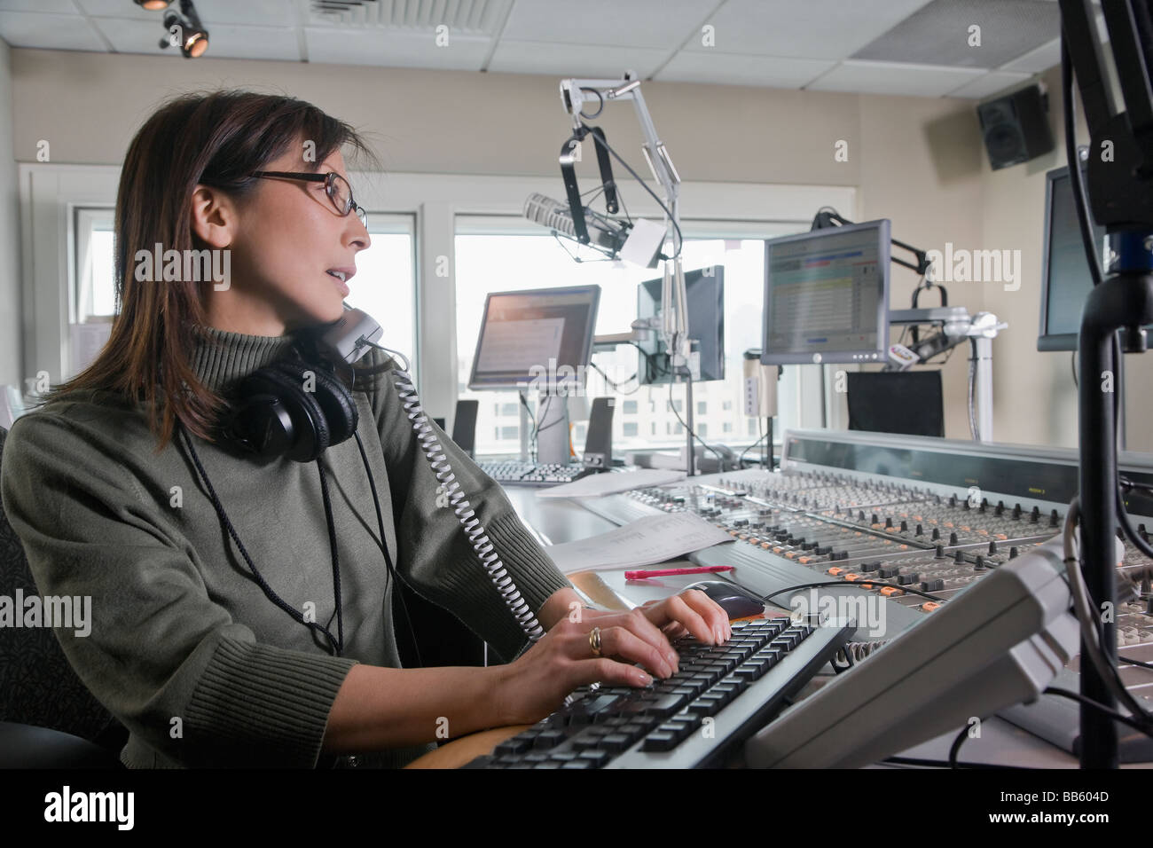 Asian dj working at radio station hi-res stock photography and images ...