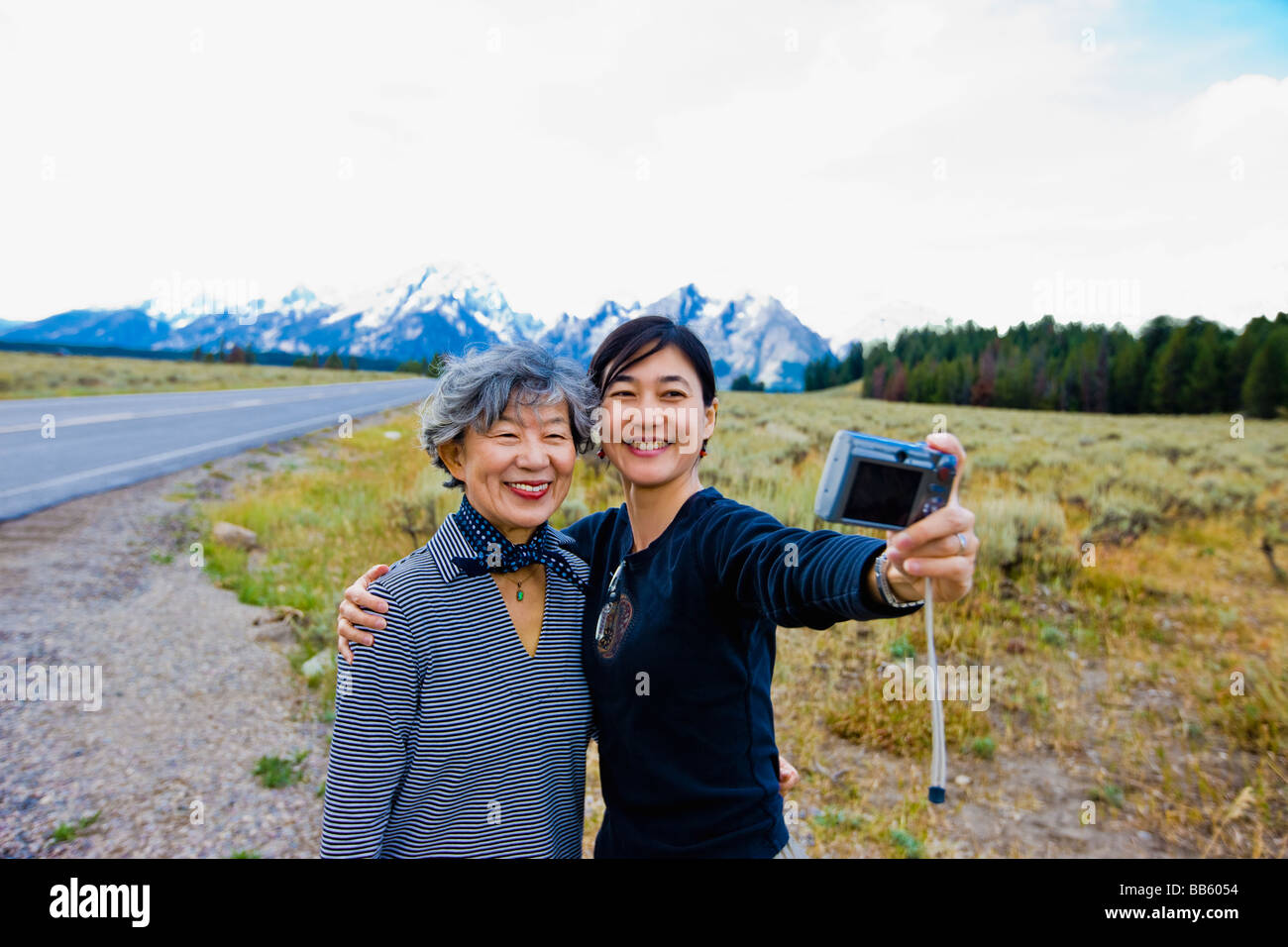 Japanese family taking self-portrait in remote area Stock Photo - Alamy