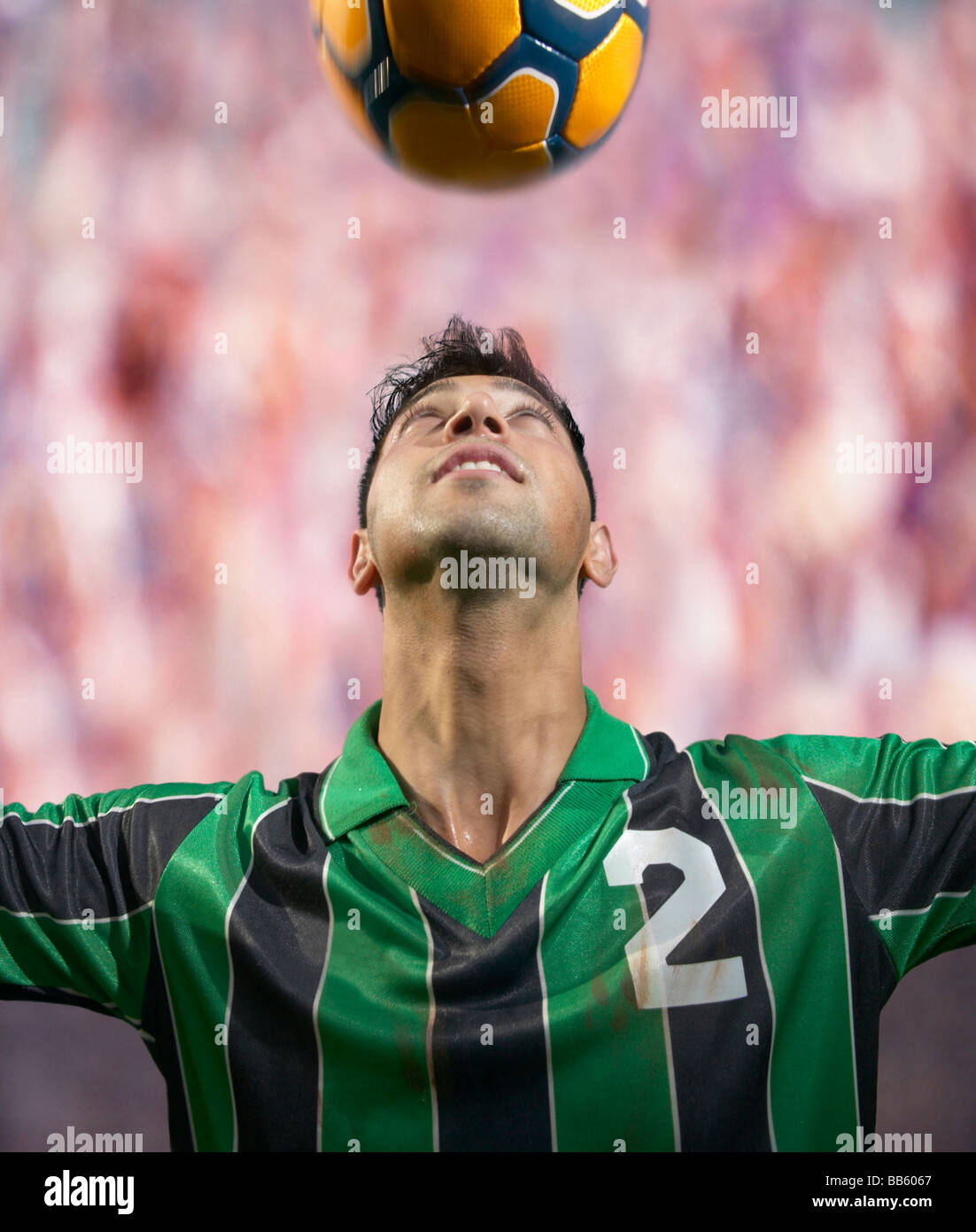 Soccer player heading the ball Stock Photo - Alamy