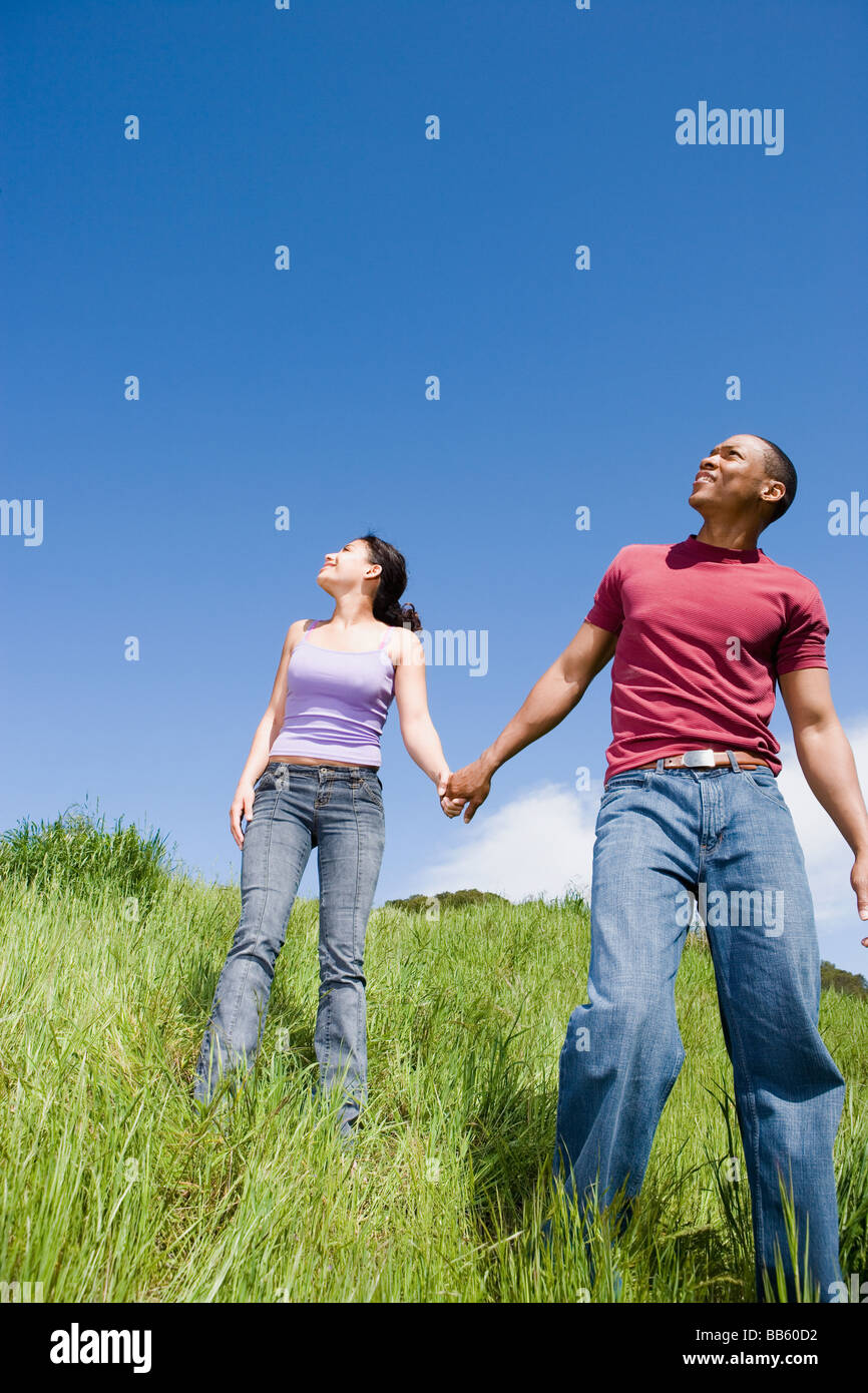 Couple walking side profile hi-res stock photography and images - Alamy