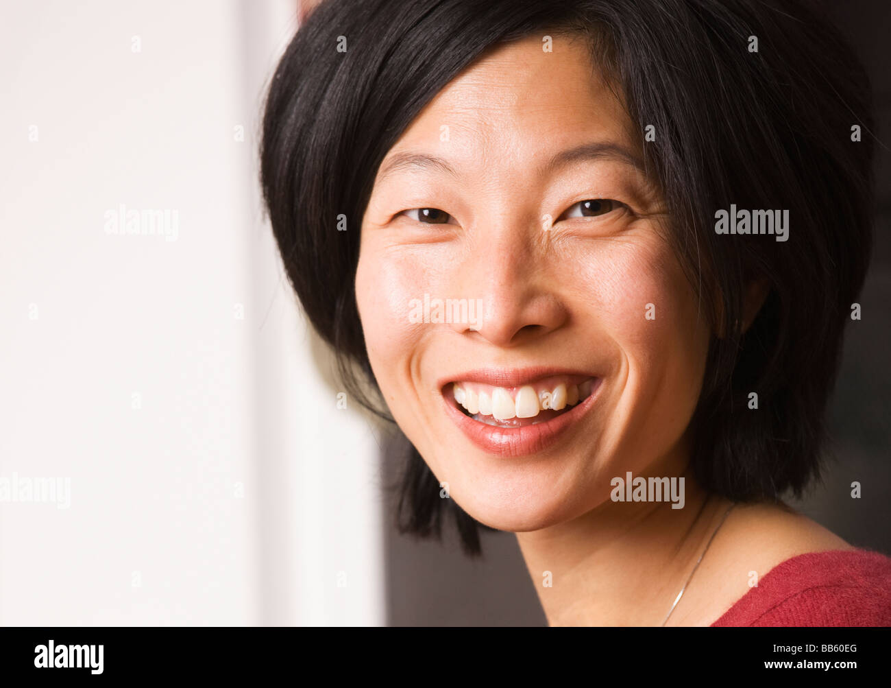Asian woman smiling Stock Photo - Alamy