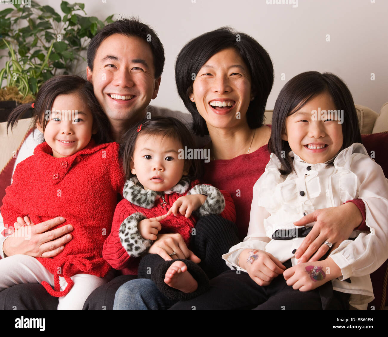 Asian family smiling together Stock Photo - Alamy