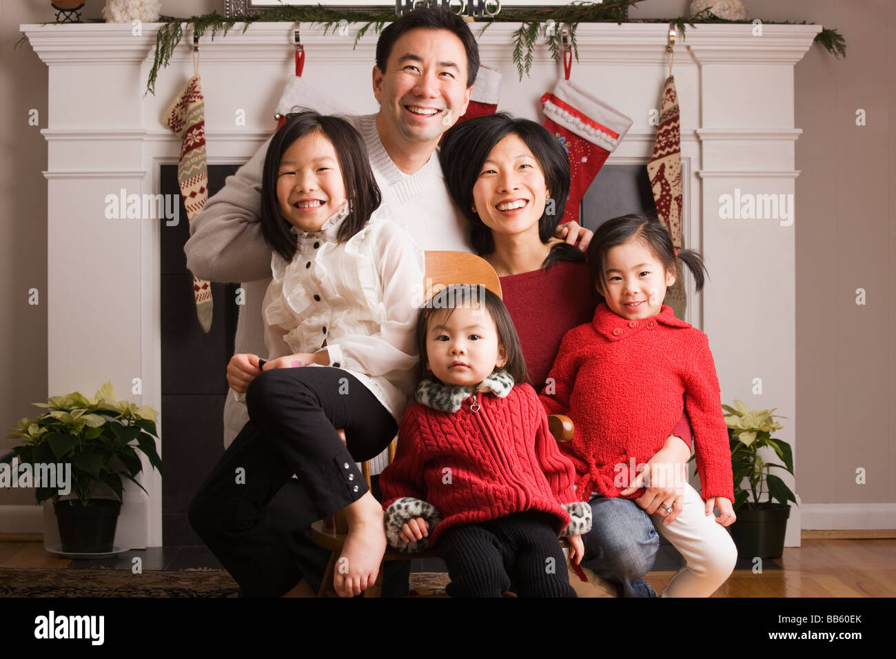 Asian family posing for Christmas photograph Stock Photo - Alamy