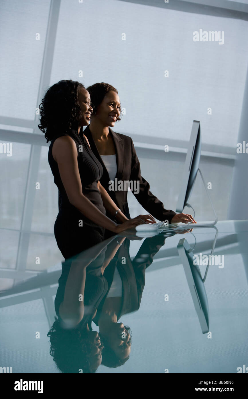 African businesswomen using computer Stock Photo - Alamy