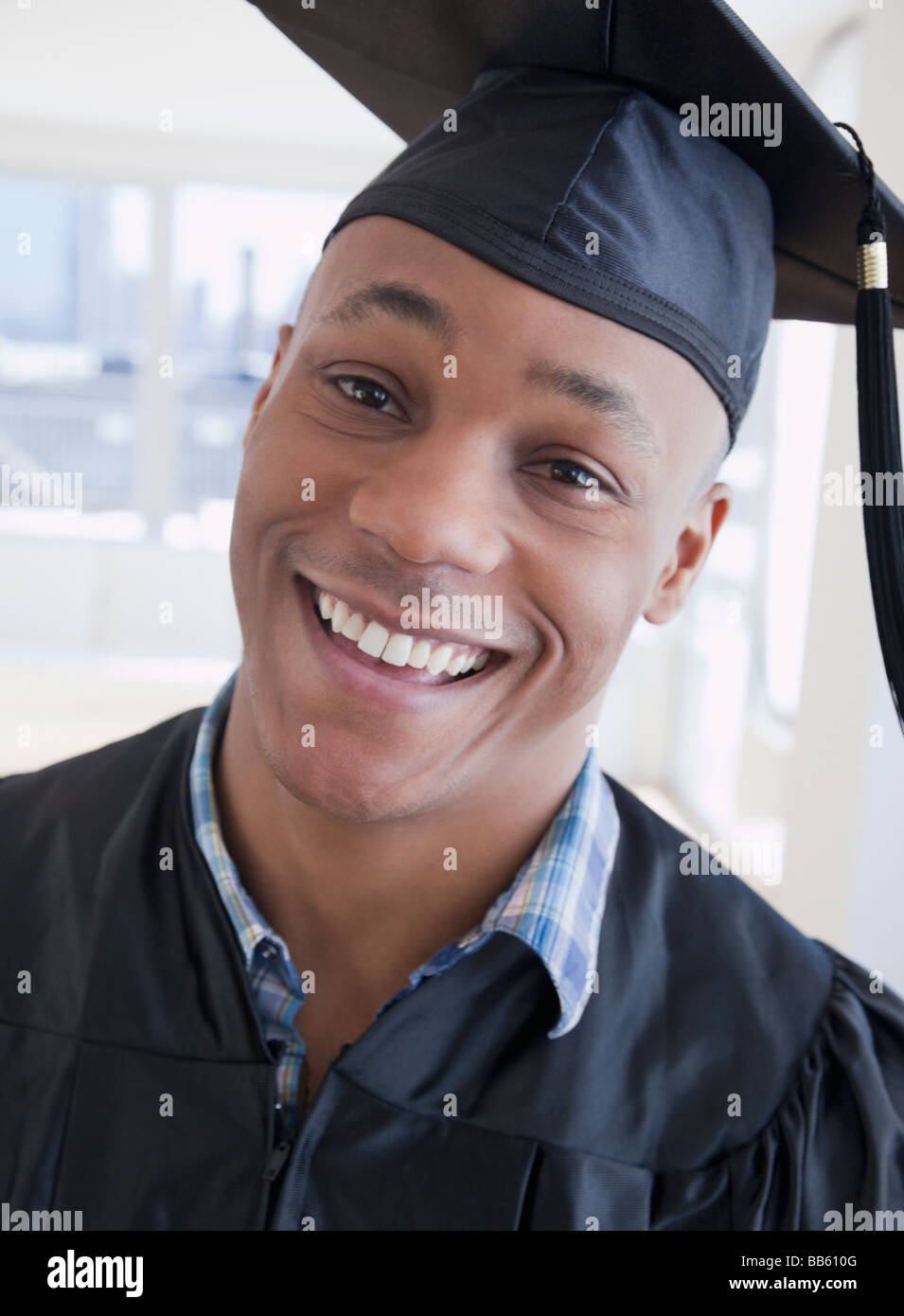 African man in graduation cap and gown Stock Photo - Alamy